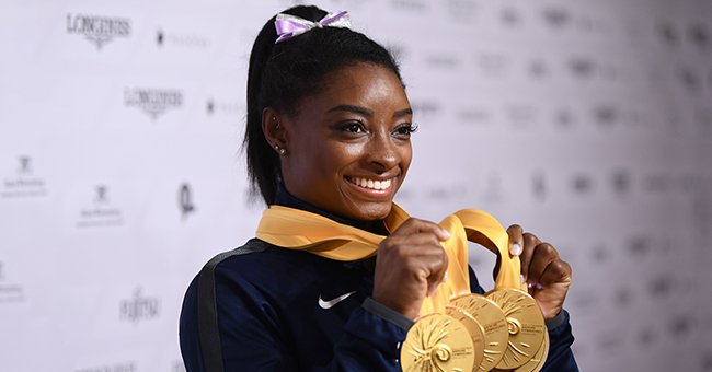 Simone Biles Shows Her Chest Piercing in a Green Dress While Posing in ...