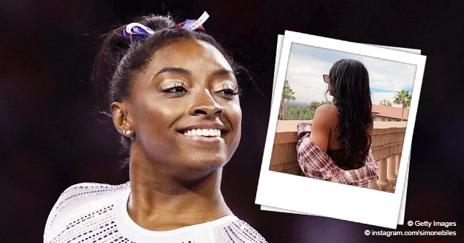 Simone Biles Looks Romantic Staring at a Beautiful View in Black Top ...