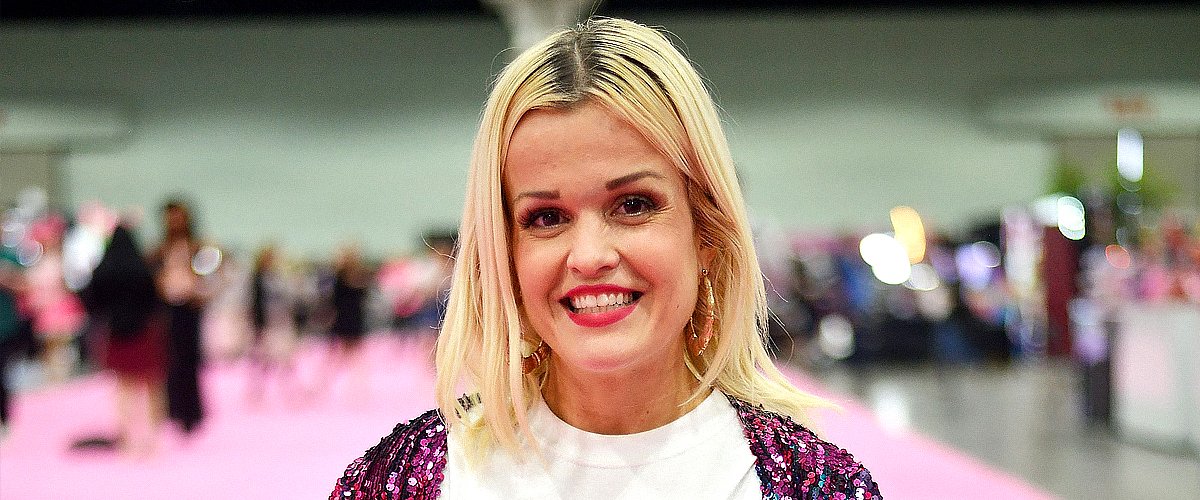 Terra Jolé's Daughter Penny Plays in the Rain Wearing a Grey Floral ...