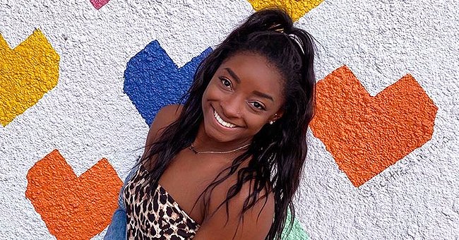 Simone Biles Shows off Athletic Figure Posing in Yellow Tube Top and ...