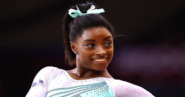 Check Out Simone Biles' White Smile as She Poses in a Grey Sweater and ...